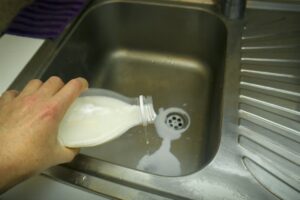 Pouring Milk Down the Drain: Safety & Clog Risks